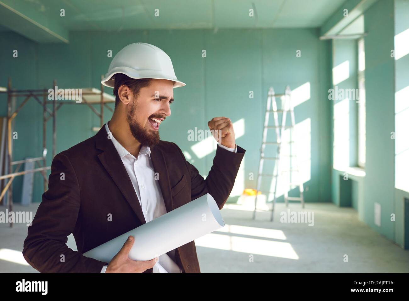 Builder foreman rejoices in a successful project at a construction ...