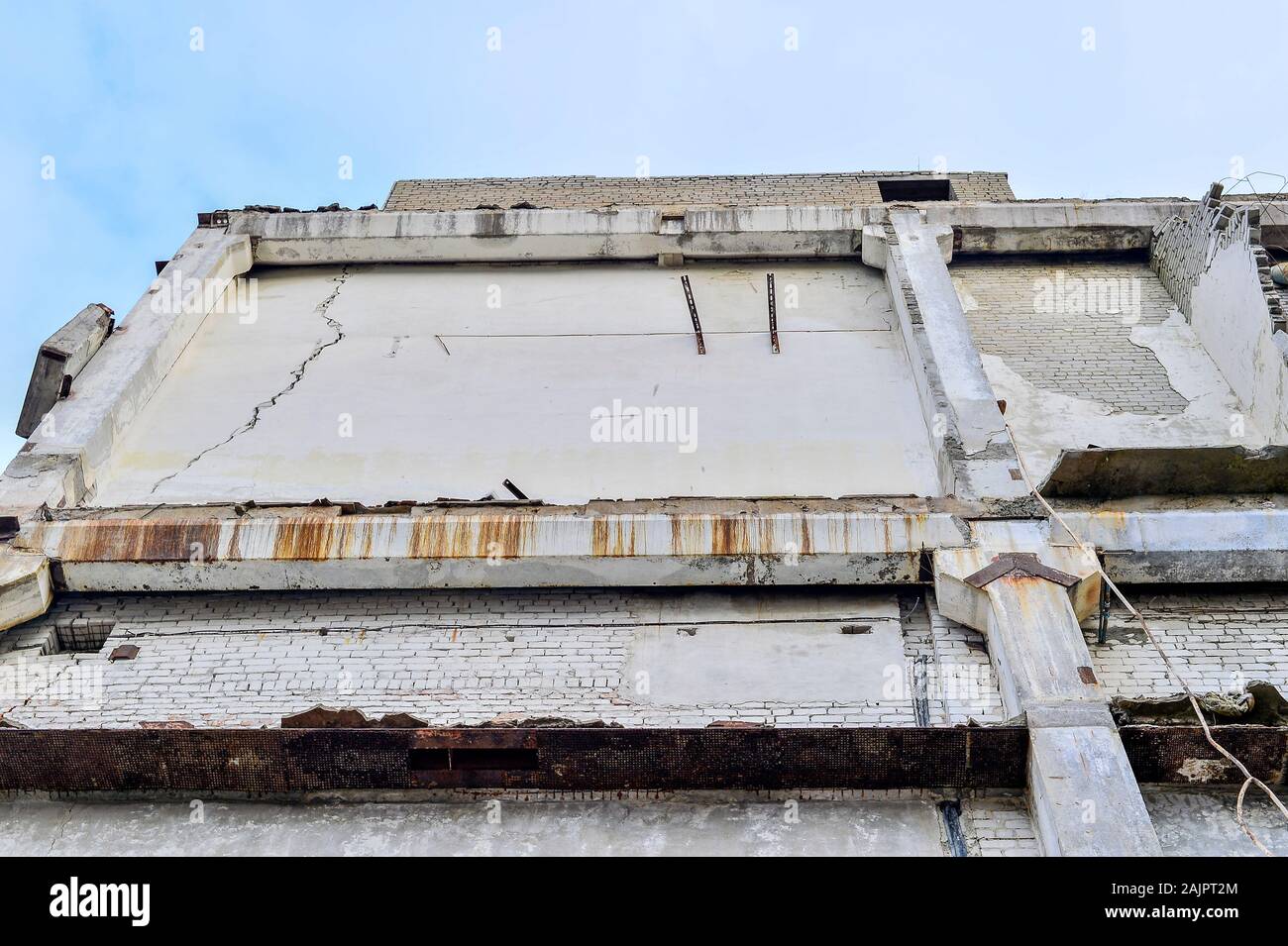 Part of the concrete wall of the destroyed building. Bottom view Stock ...