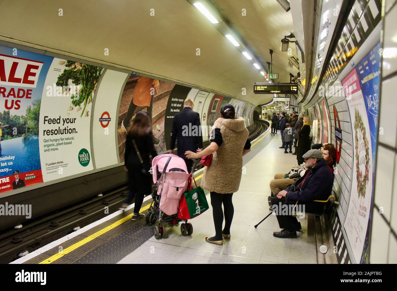 leicester square northern line tube london with passengers awaiting ...