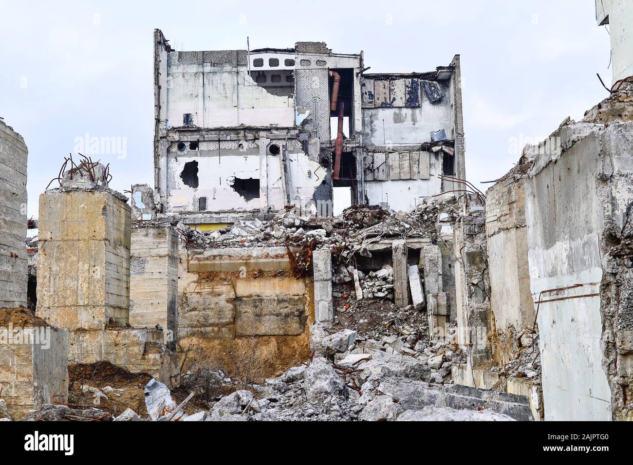 Remains of the destroyed industrial building. Background Stock Photo ...