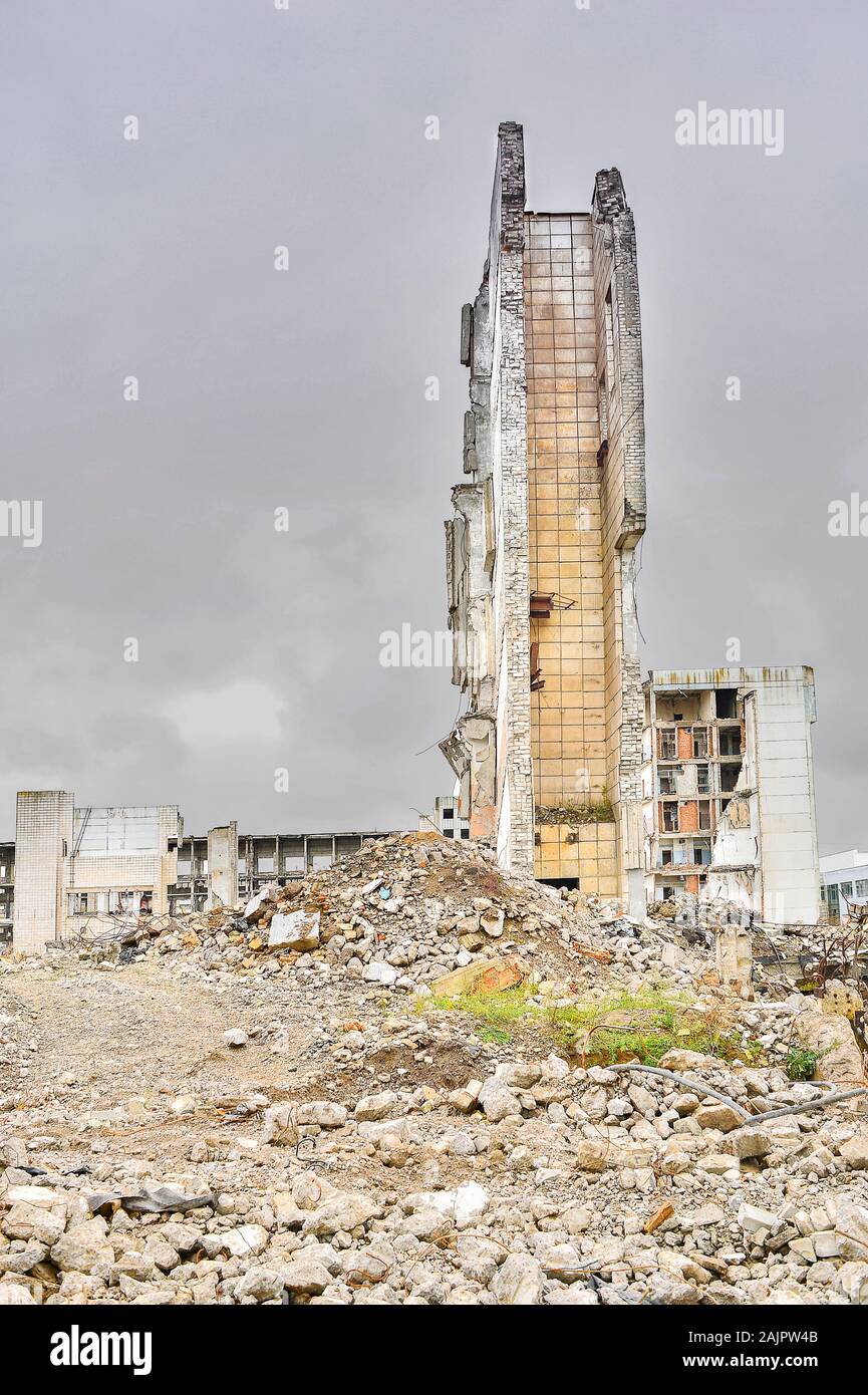 The wall remained untouched, a pile of stones made of concrete in the ...