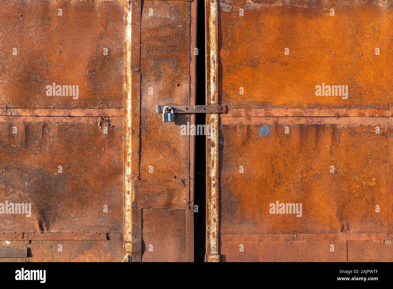 Closed metal door with lock. Metal door rusty corroded texture ...
