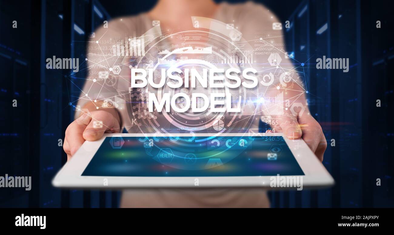 Young business person working on tablet and shows the inscription ...