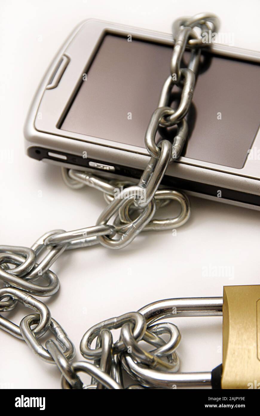 pocket pc tied with a chain and lock, concept for computer security ...