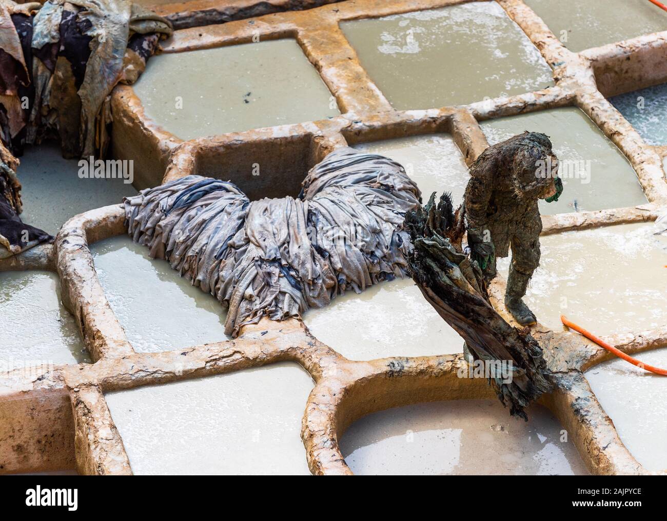 Dye reservoirs and vats in traditional tannery of city of Fez, Morocco ...