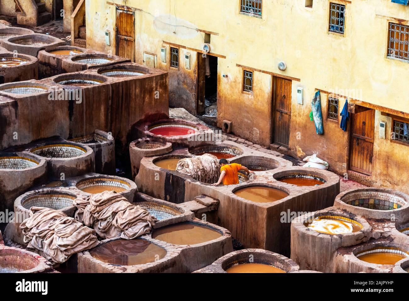 Dye reservoirs and vats in traditional tannery of city of Fez, Morocco ...
