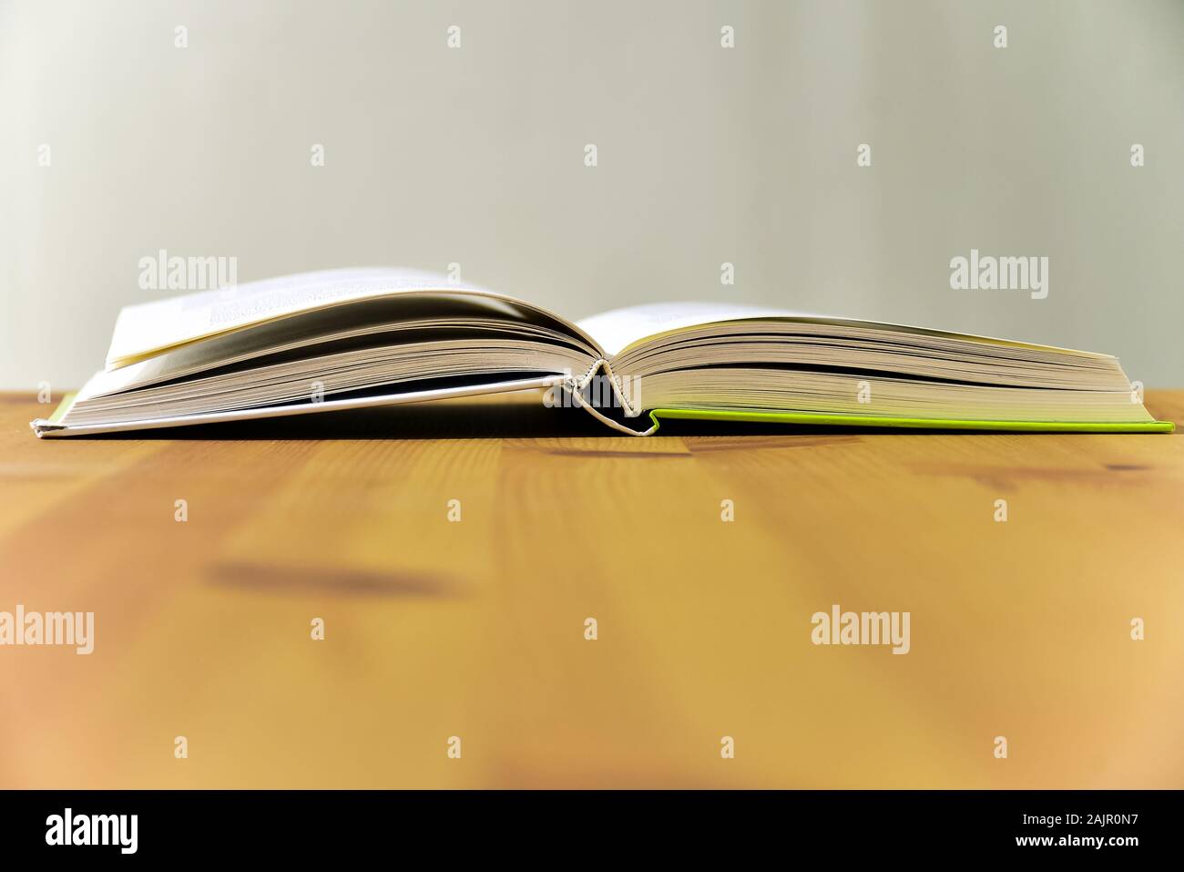 Book lying on the table hi-res stock photography and images - Alamy