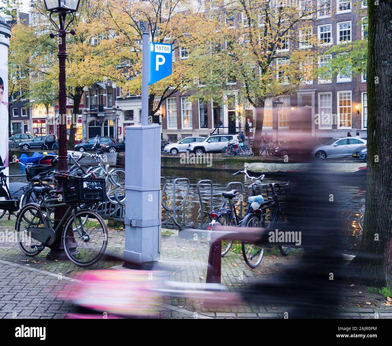 Parking meter and bicycle racks on Amsterdam's Herengracht Stock Photo ...