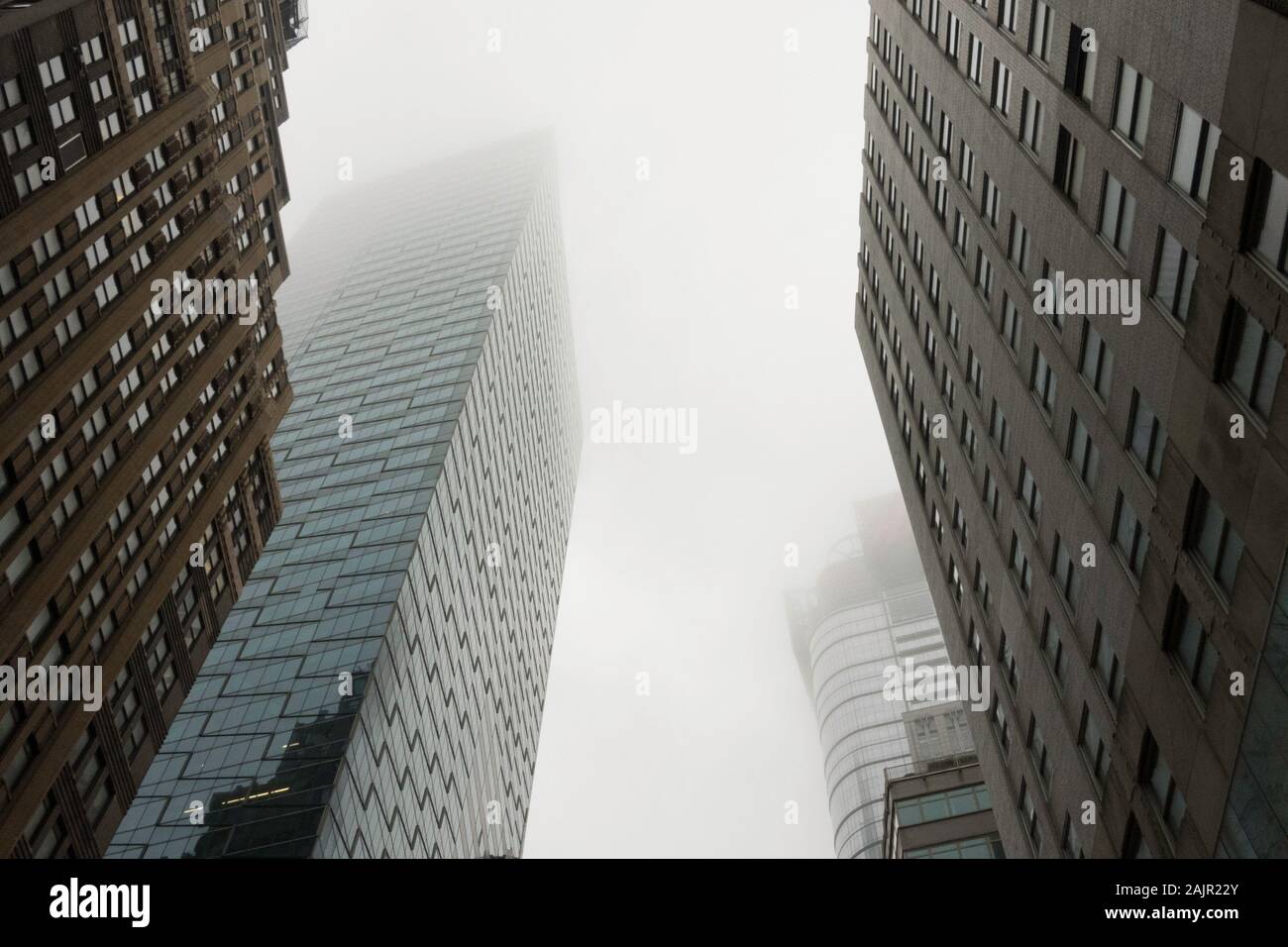 Visibility is obscured by low hanging fog in Times Square, NYC, USA ...
