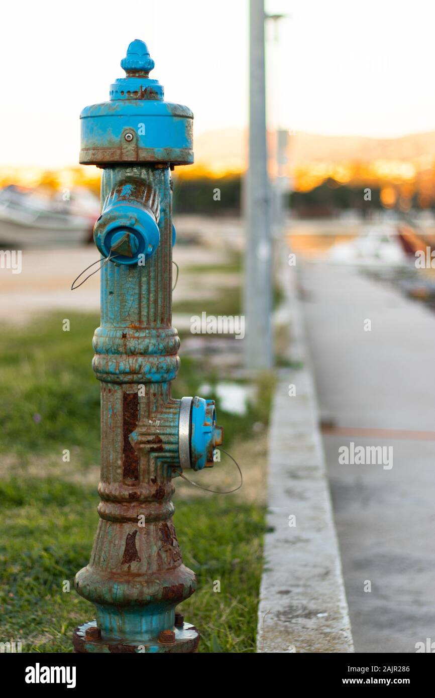 Rusted blue fire hydrant Stock Photo - Alamy