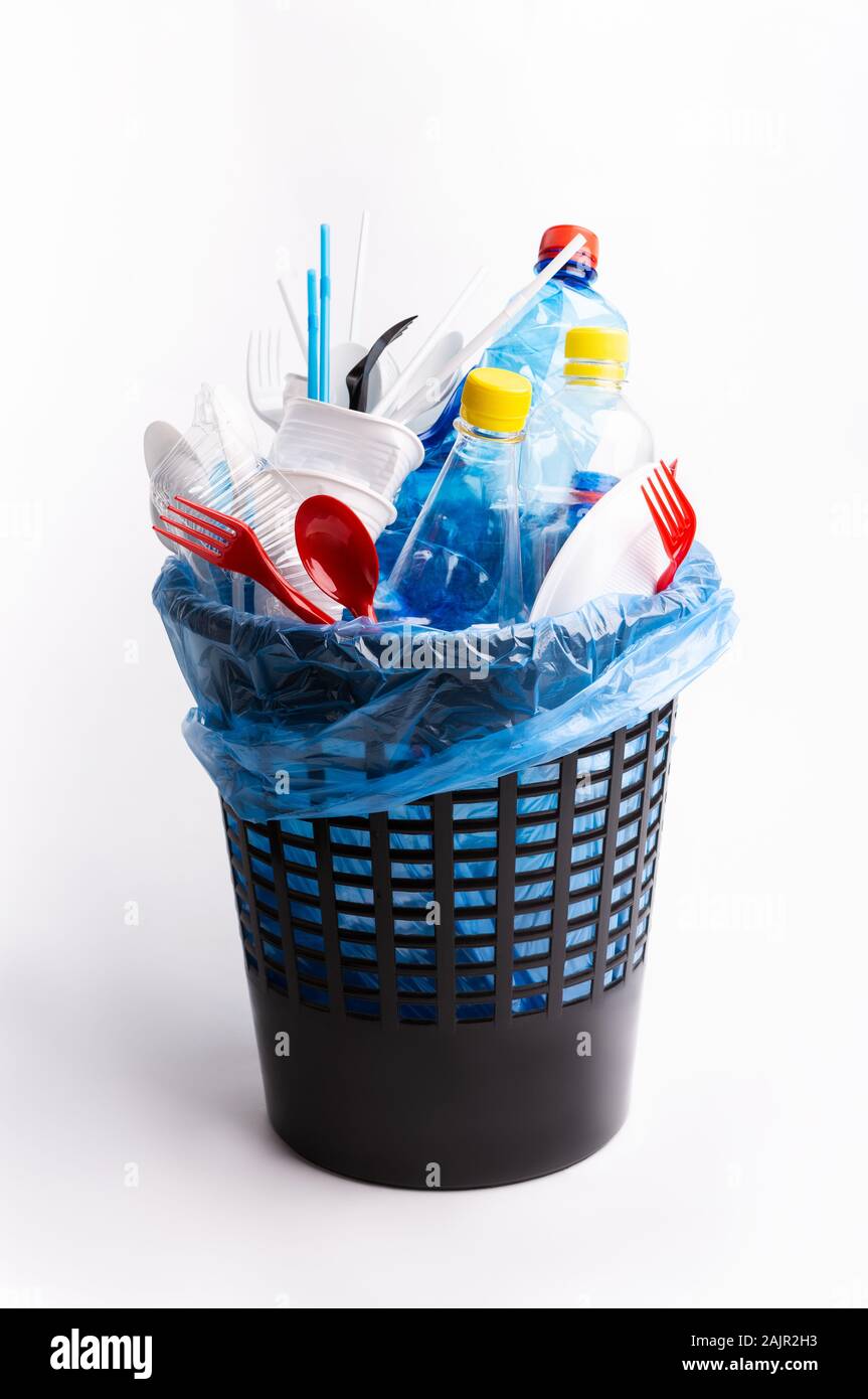 Waste heap. Rubbish bin full of plastic trash or junk isolated on white ...