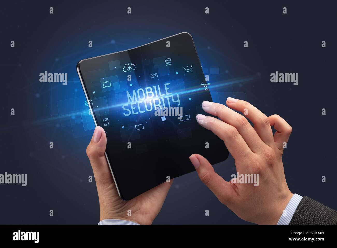 Businessman holding a foldable smartphone with MOBILE SECURITY ...
