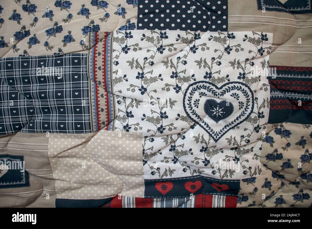 Detail of blue and white patchwork quilt with hand quilting Stock Photo - Alamy