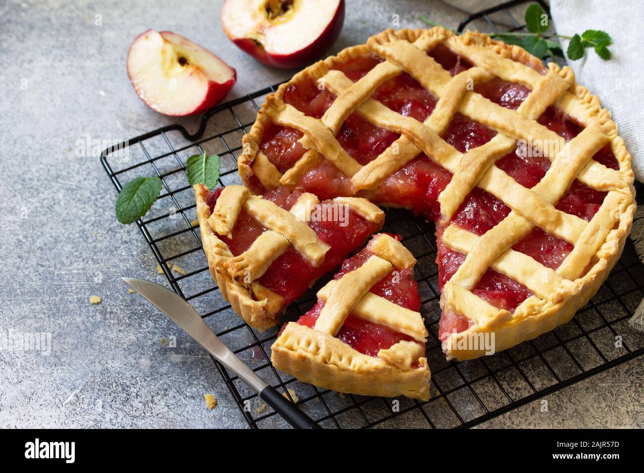 Homemade baking. Autumn apple pie on a light stone or slate table. Free ...