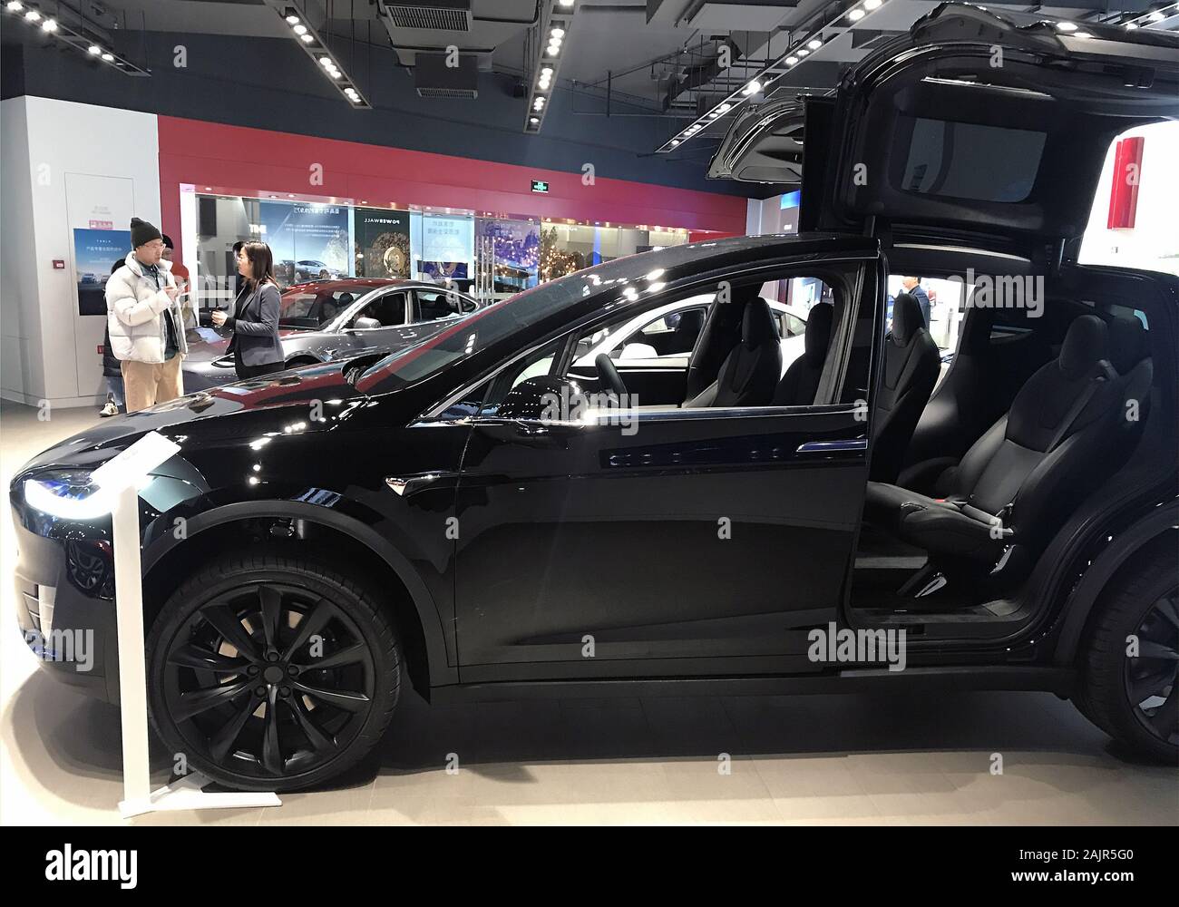 Beijing, China. 05th Jan, 2020. Chinese visit Tesla's flagship showroom ...