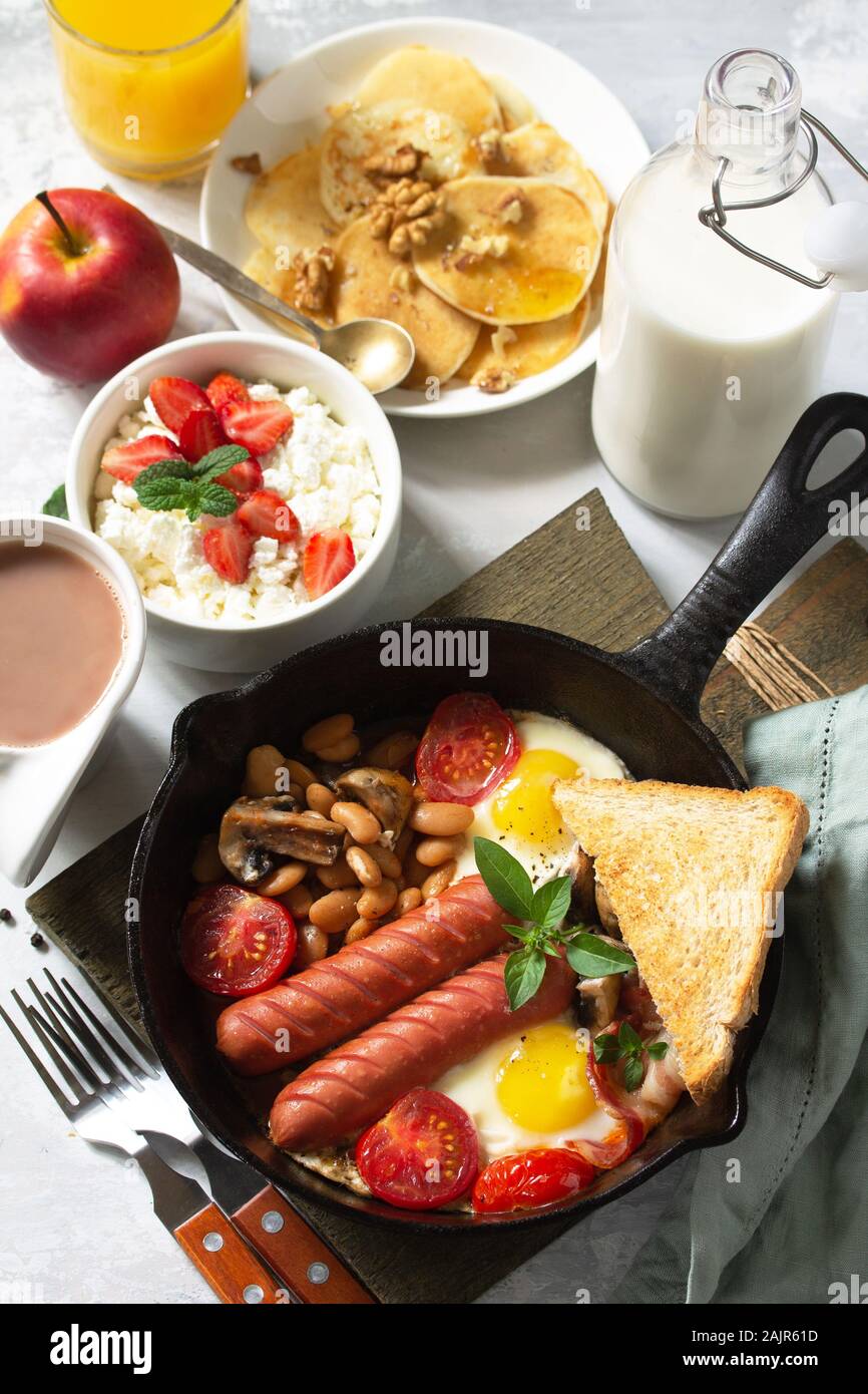 Keto breakfast: fried eggs, sausages, beans, bacon, mushrooms, grilled ...