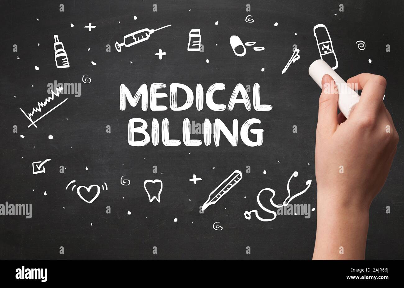 Hand drawing MEDICAL BILLING inscription with white chalk on blackboard ...
