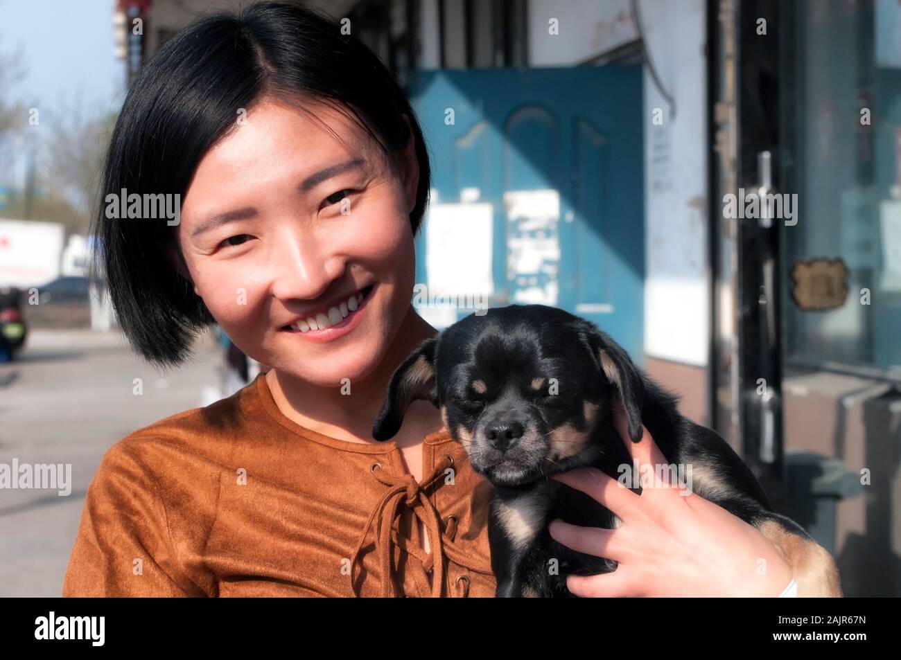Chinese woman and dog hi-res stock photography and images - Alamy