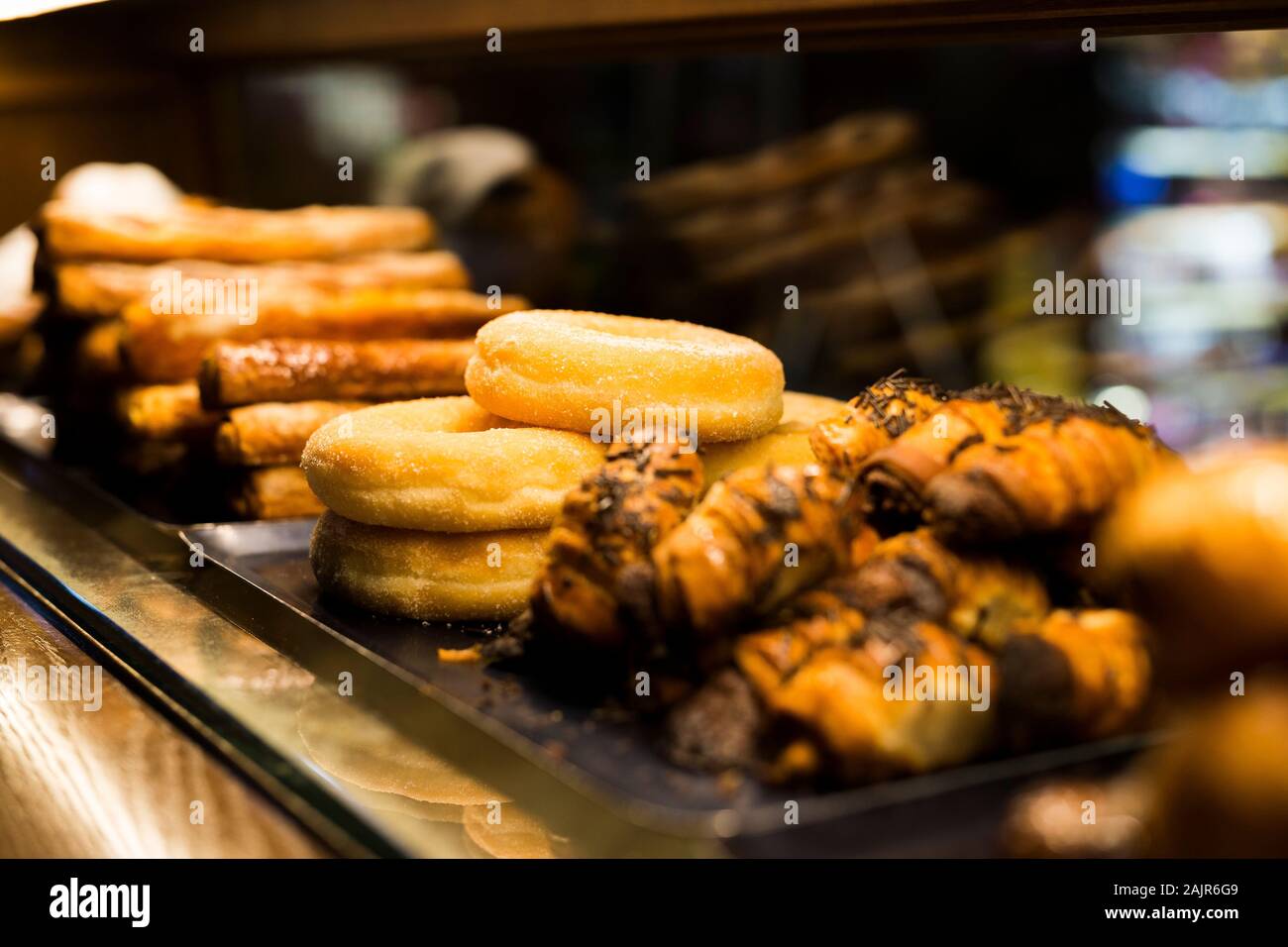 Doughnuts in a window of a bakery Stock Photo - Alamy
