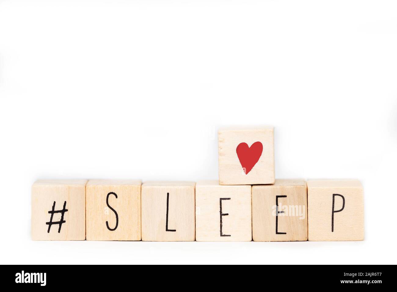 Wooden cubes with a Hashtag and the word Sleep isolated on white ...