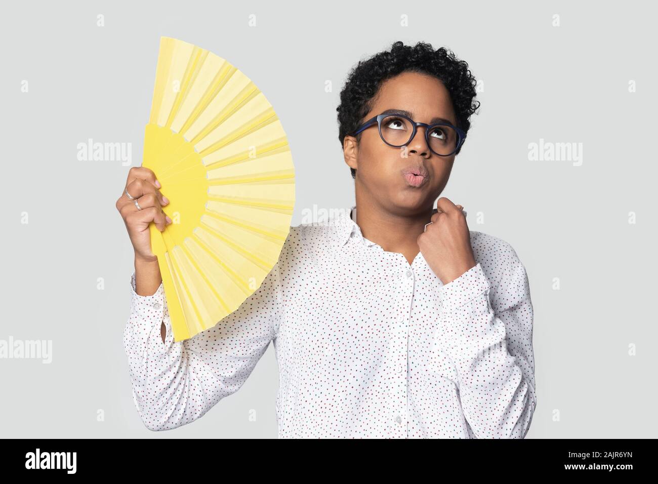 Woman fanning herself hi-res stock photography and images - Alamy