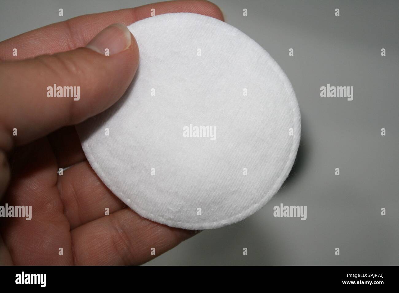 Cotton swab in a woman's hand Stock Photo - Alamy