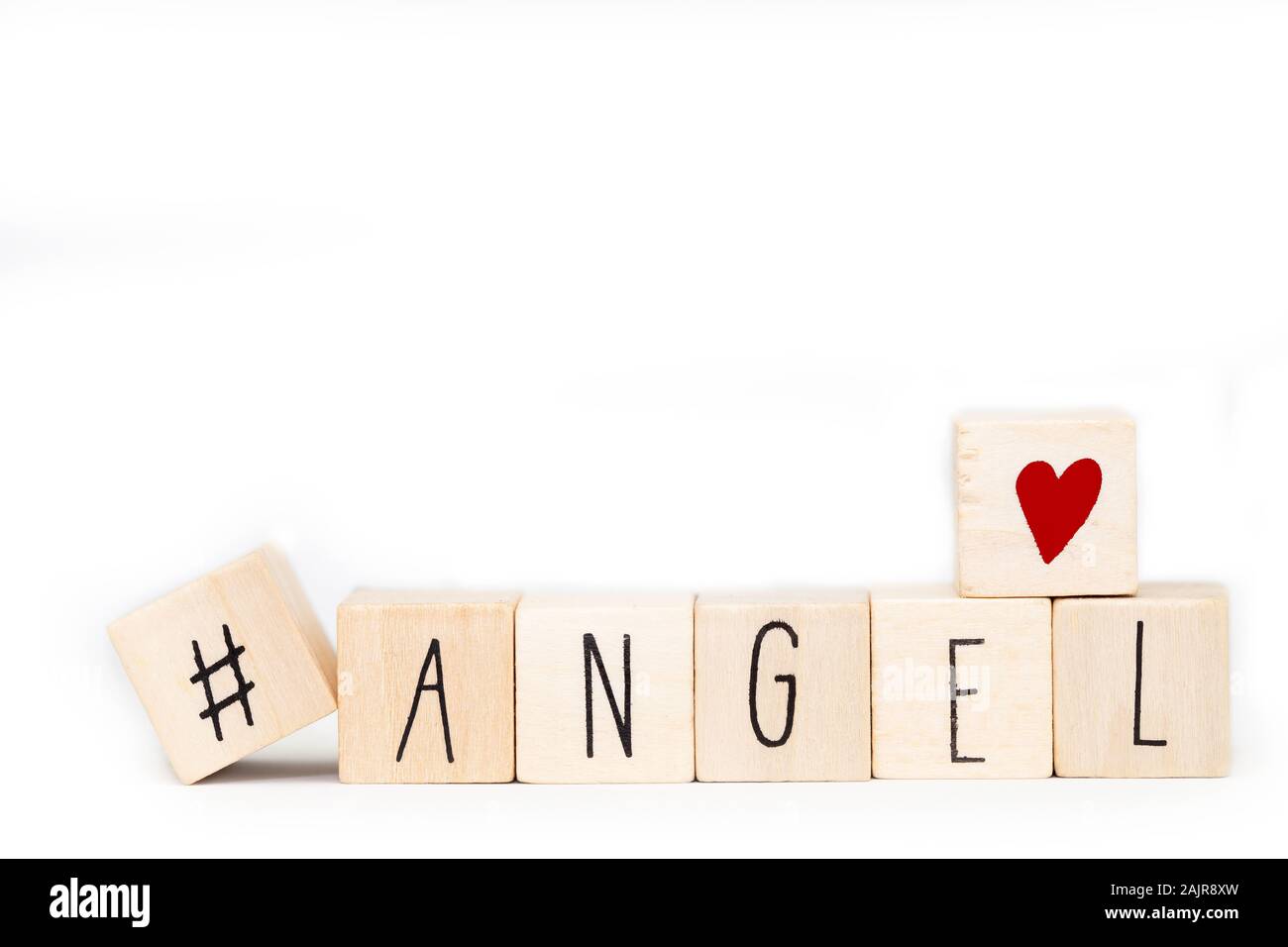 Wooden cubes with a hashtag and the word Angel isolated on white ...