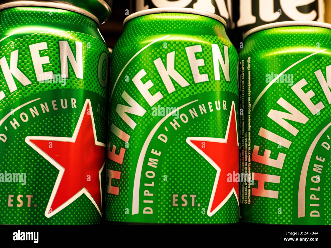 Heineken beer cans on a store shelf Stock Photo - Alamy