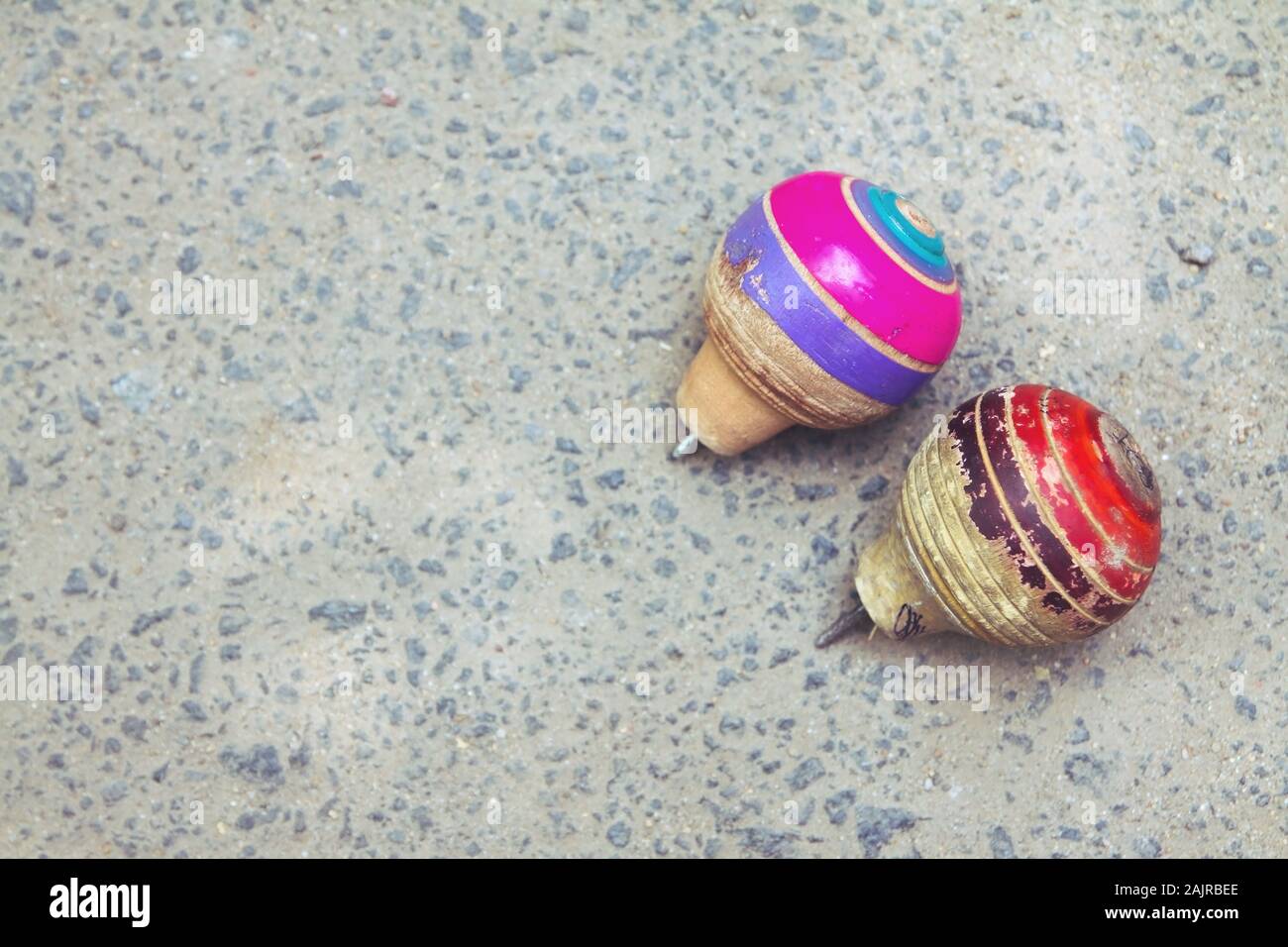 Classic wooden spinning top toy with string Stock Photo - Alamy
