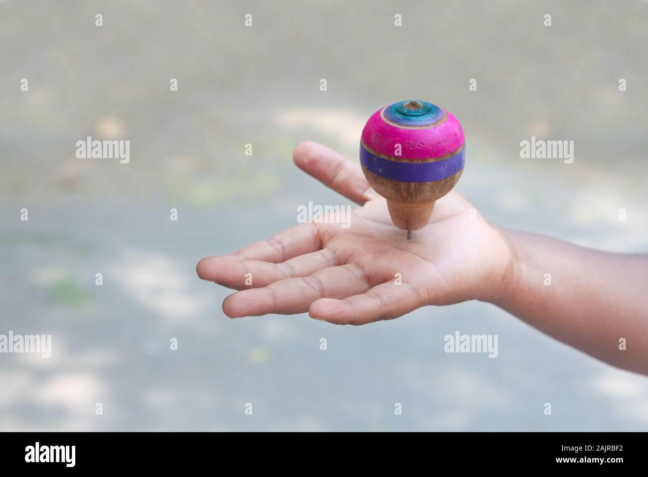 Old wooden spinning top toy hi-res stock photography and images - Alamy