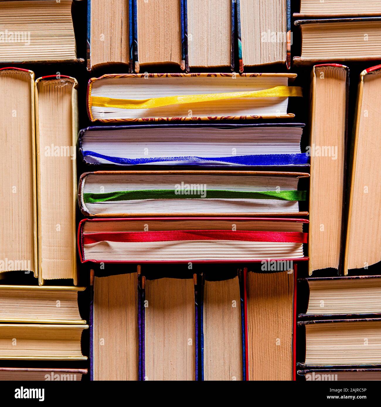 Lots of multi-colored books with multi-colored bookmarks close-up Stock ...