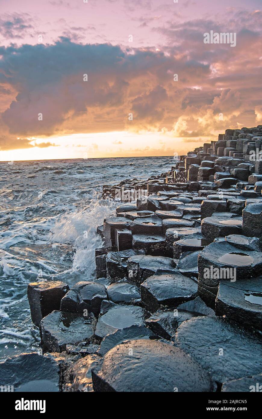 Sunset with the Giant's Causeway in the foreground Stock Photo - Alamy