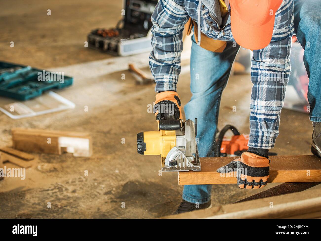 Contractor with Electric Circular Saw Cut Wood Plank. Construction ...