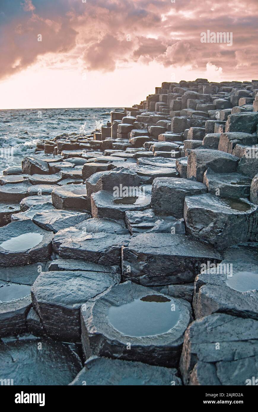 Sunset with the Giant's Causeway in the foreground Stock Photo - Alamy