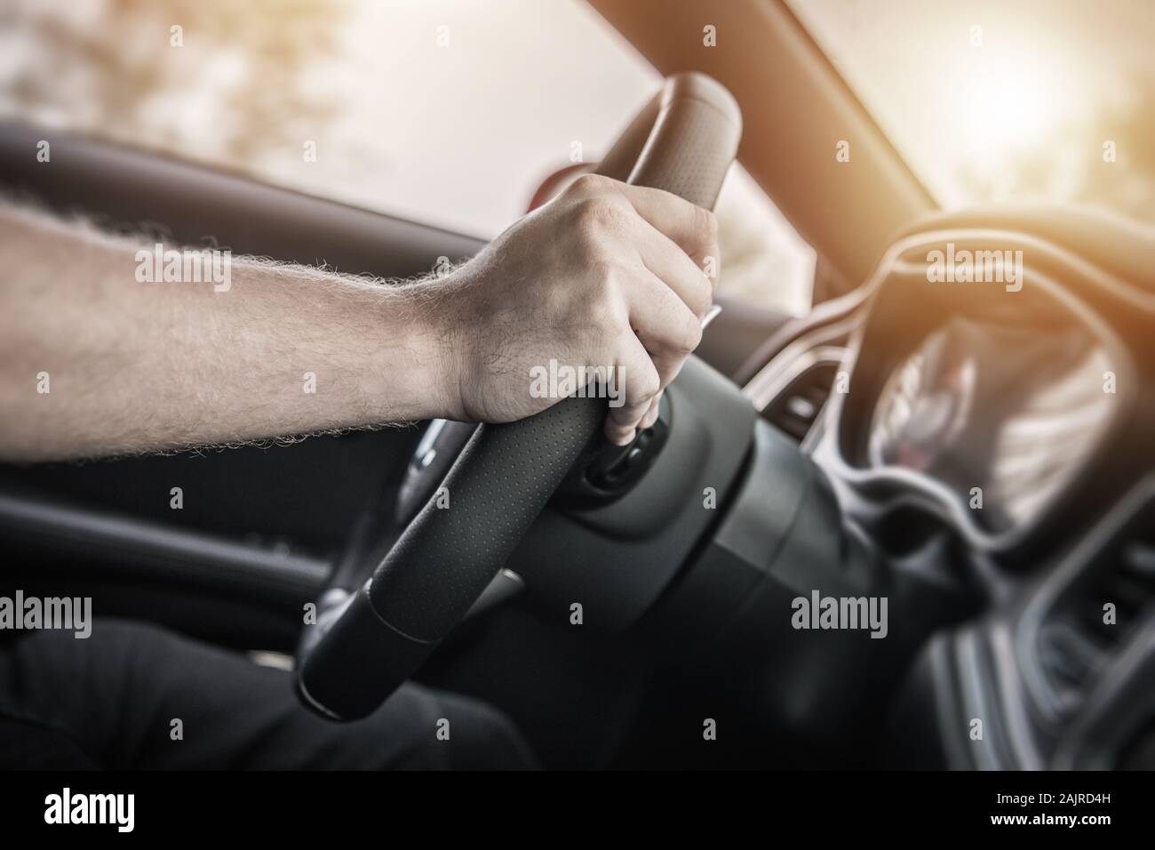 Transportation Industry. Caucasian Driver Behind the Car Steering Wheel ...