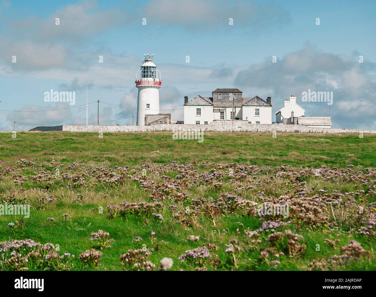 Lighthouse on a cliff in Howth, Ireland Stock Photo - Alamy