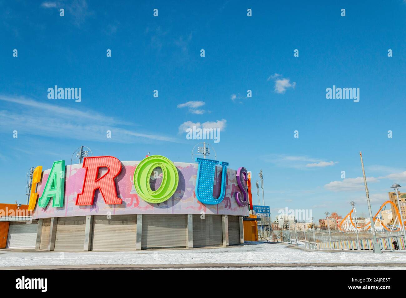 winter scene of large coloured letters spelling carousel at the out of ...