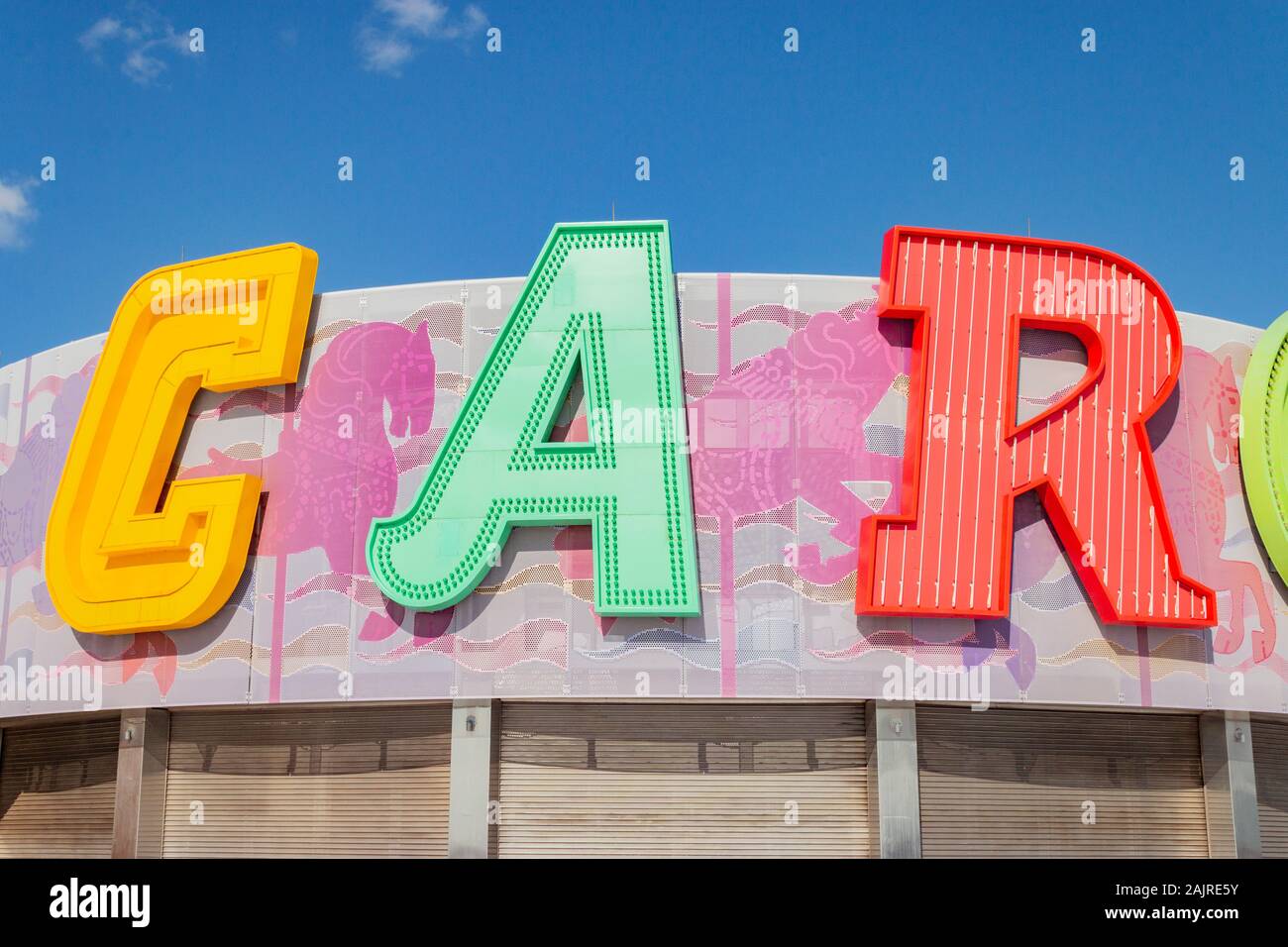 winter scene of large coloured letters spelling carousel at the out of ...