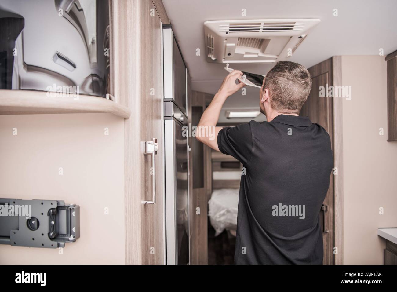 Caucasian RV Caravaning Technician Replacing Air Condition Filter ...