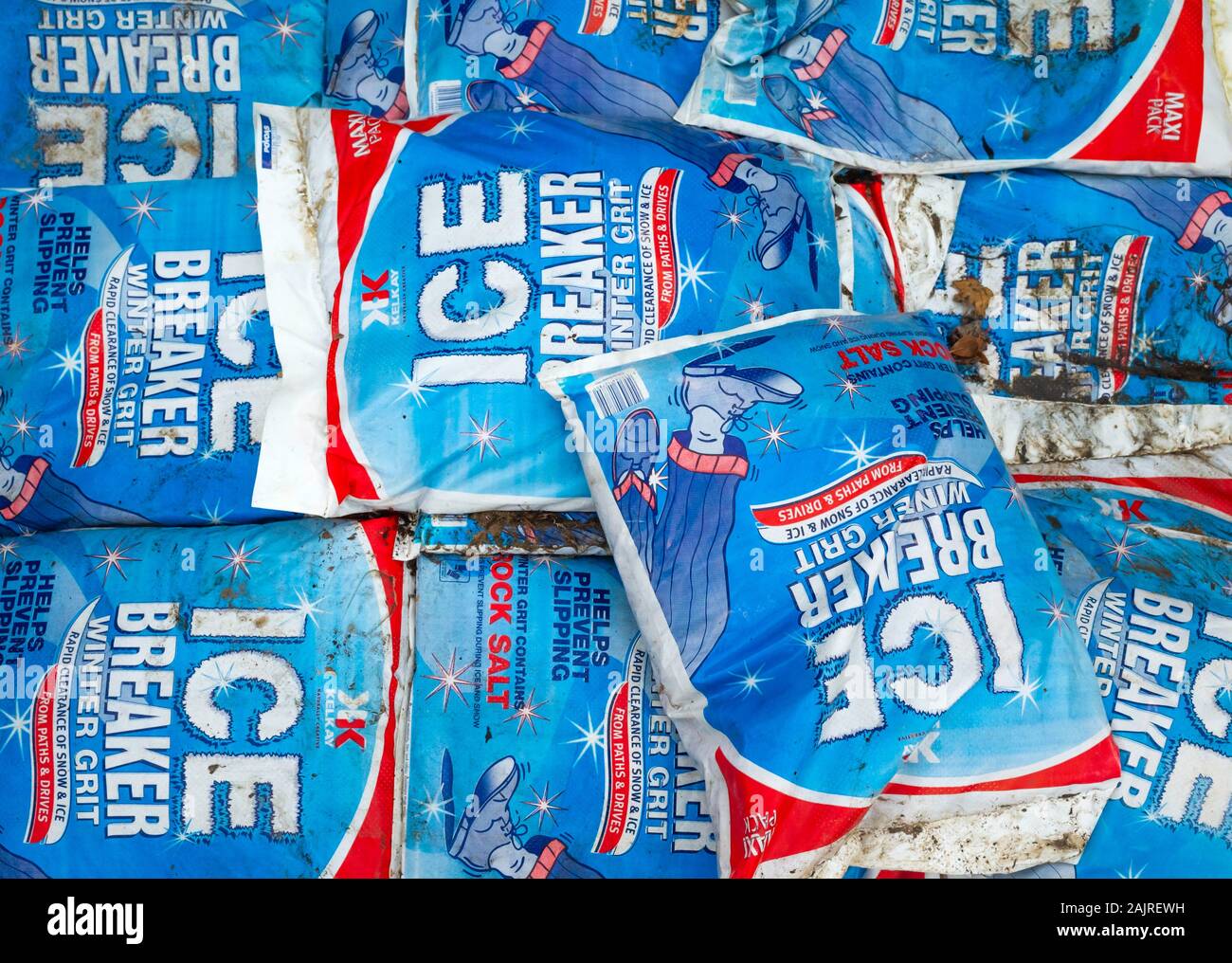 Stack of bags of Ice Breaker winter grit for clearing pathways and ...