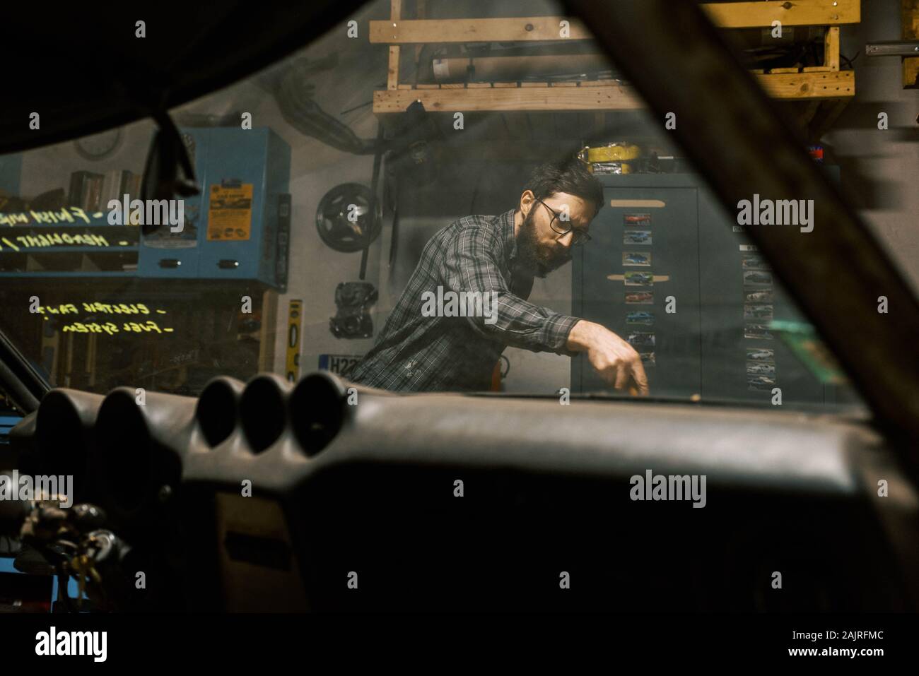 Man In Garage With Car High Resolution Stock Photography and Images - Alamy