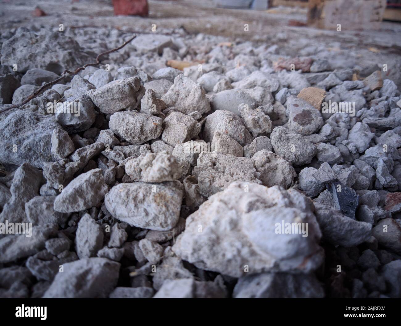 coarse aggregates covered with cement and dust at the construction ...