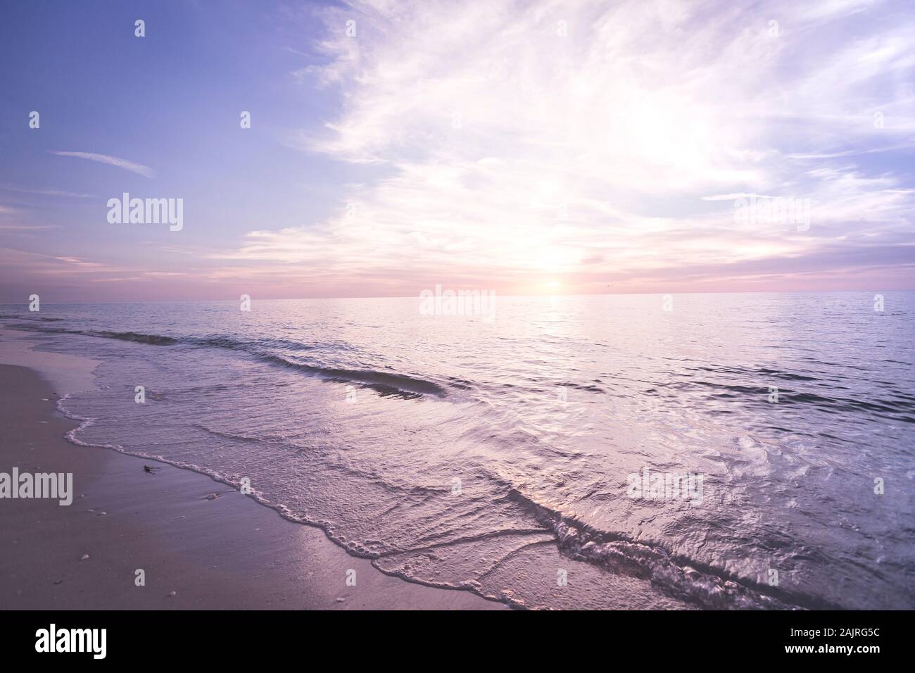Colorful sunset ocean and beach Stock Photo - Alamy
