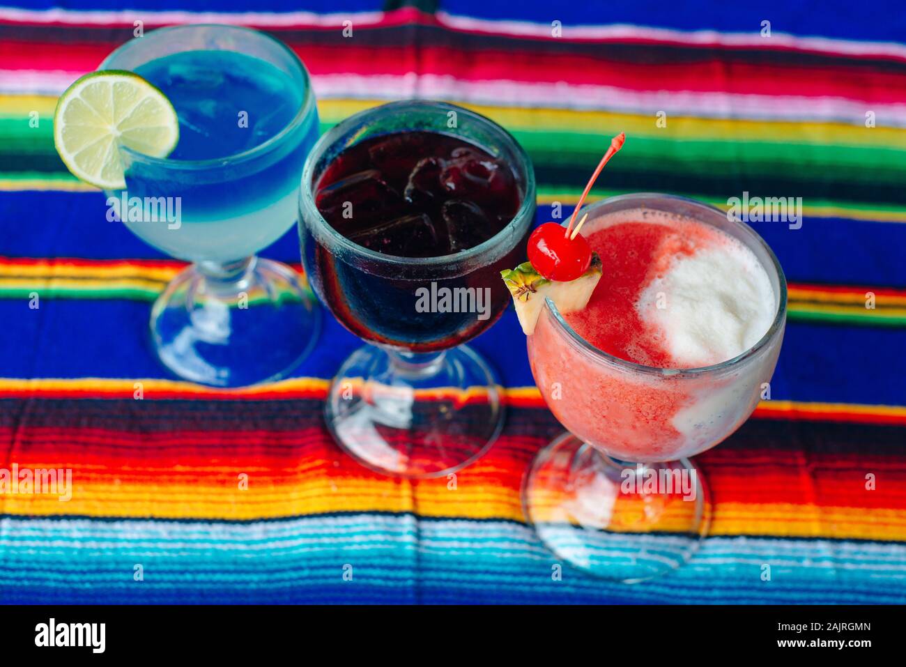 multi-colored cocktails in large glasses in restaurant Mexico Stock ...