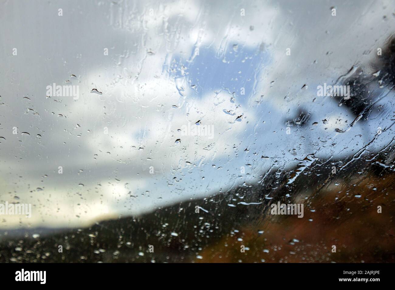 Car window with rain drops. Driving in rain. Weather background. Rainy ...