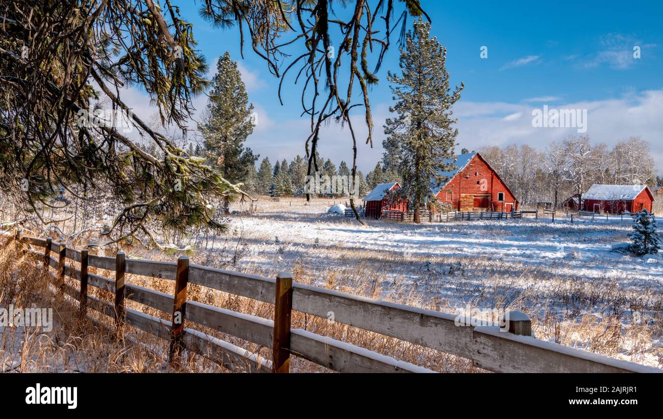Winter farm with snow on the ground and a red barn Stock Photo - Alamy
