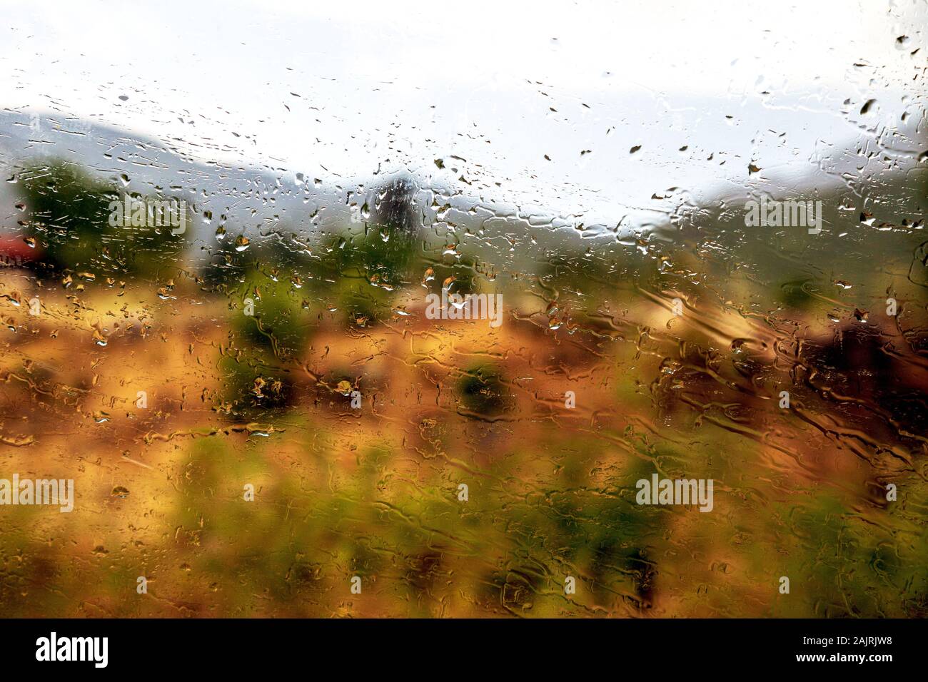 Car window with rain drops. Driving in rain. Weather background. Rainy ...