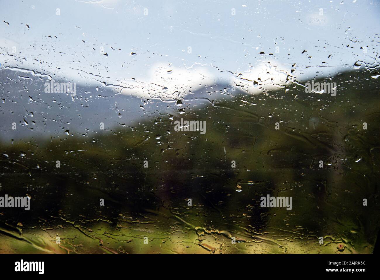 Car window with rain drops. Driving in rain. Weather background. Rainy ...