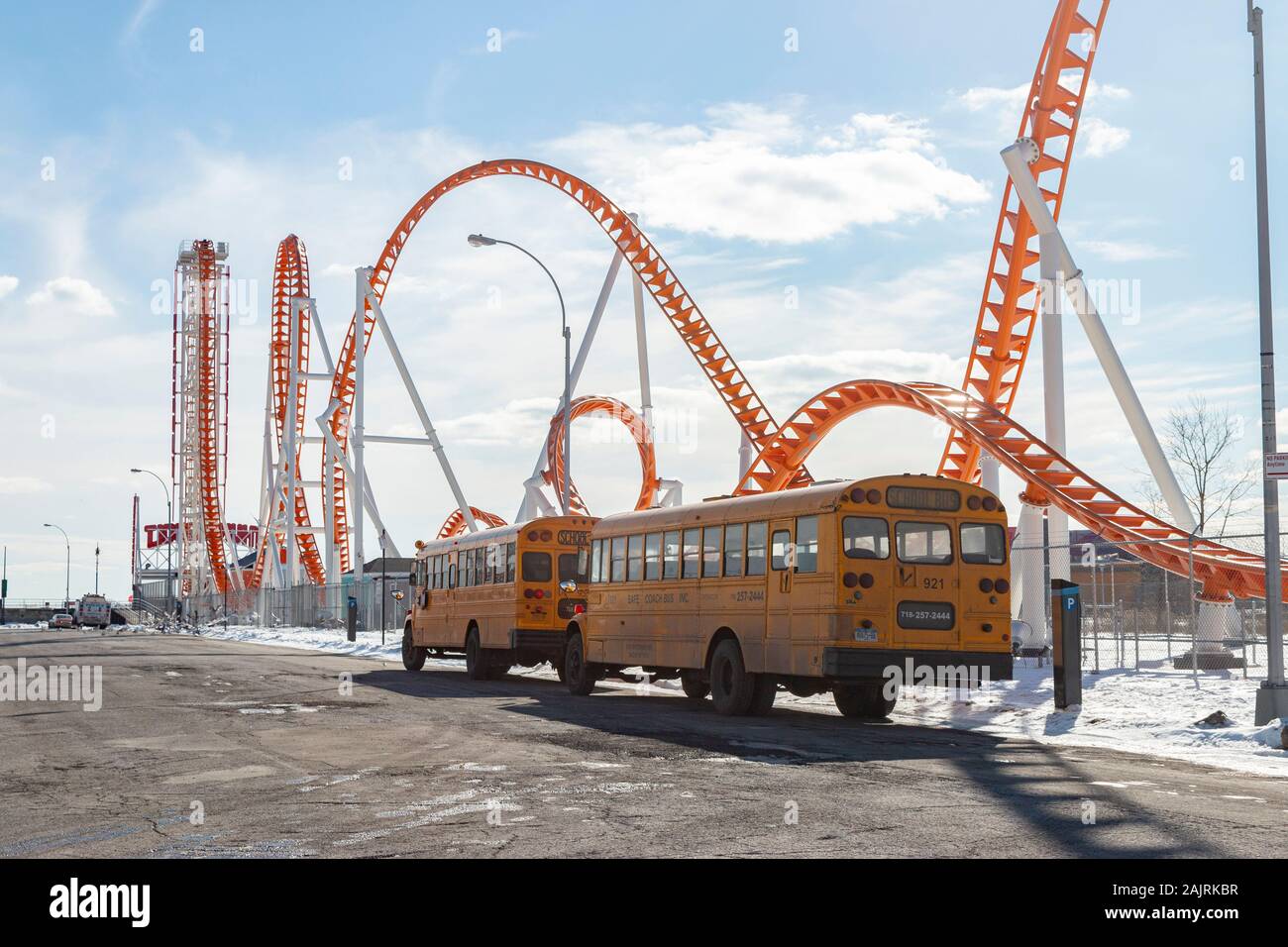 two classic yellow school buses parked in front of the Thunderbolt ...