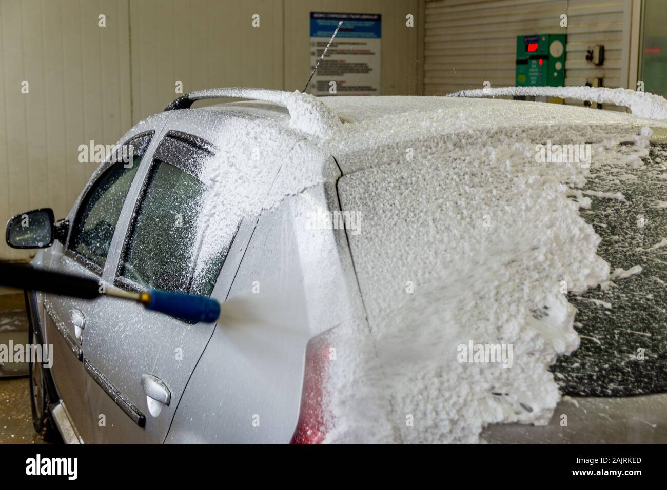 a car foam application process while washing indoors Stock Photo - Alamy